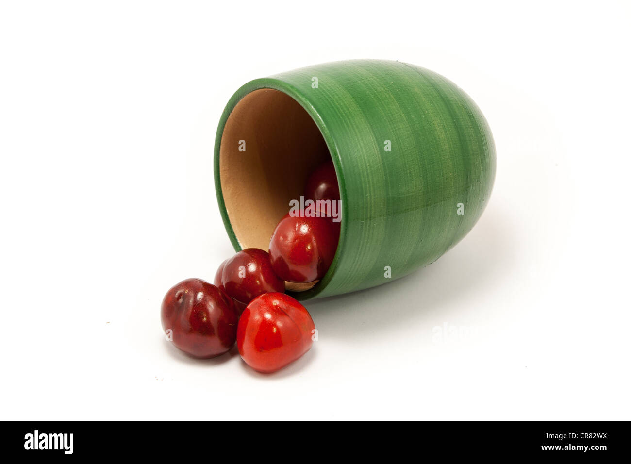 Juicy ruby red cherries in a green cup Stock Photo - Alamy