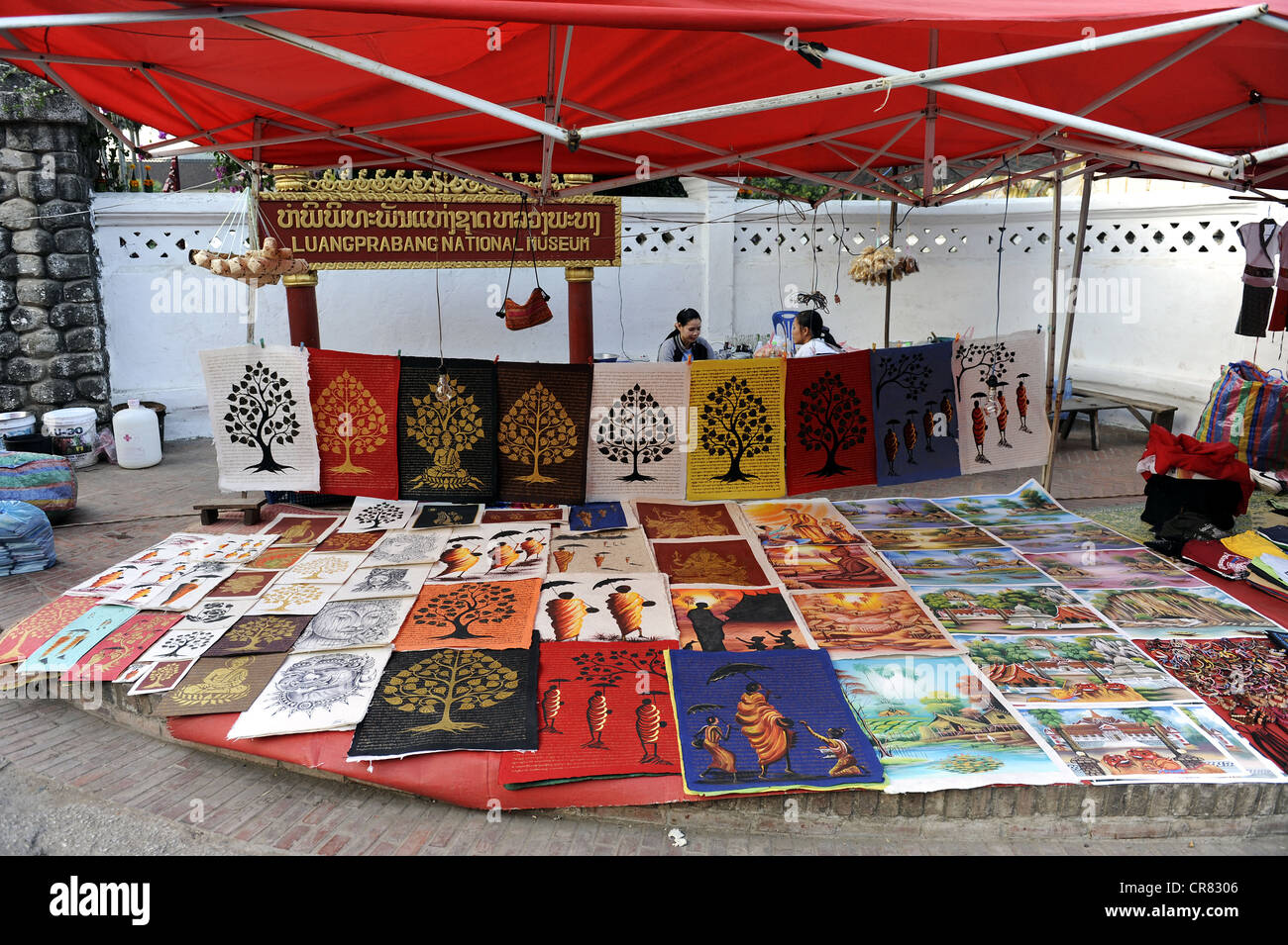Market stall with posters on the night market, Luang Prabang, Laos ...