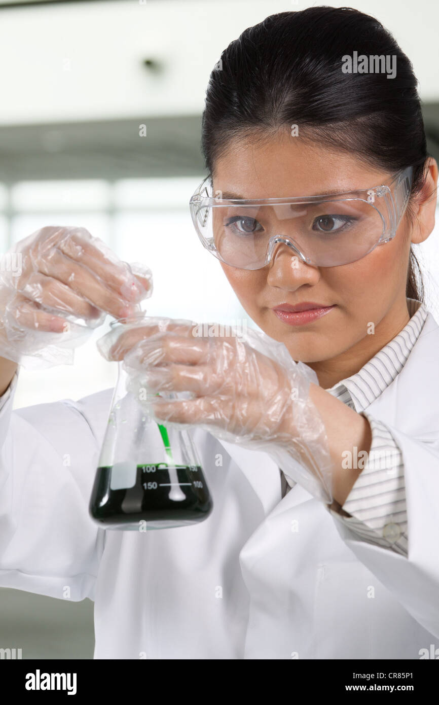 Portrait of a scientist analyzing a solution Stock Photo - Alamy