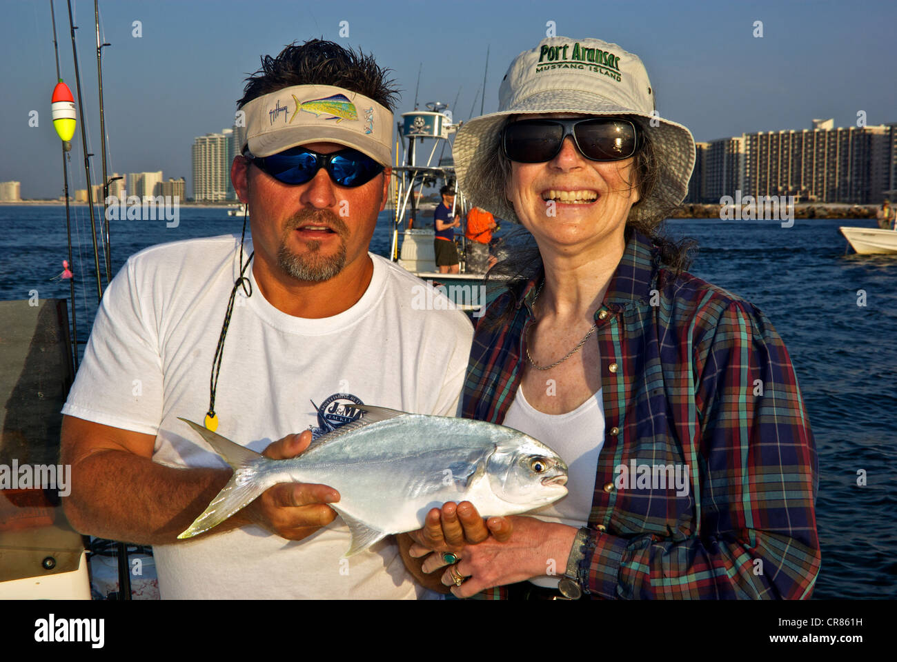 Sport fishing guide female angler holding pompano inshore saltwater ...