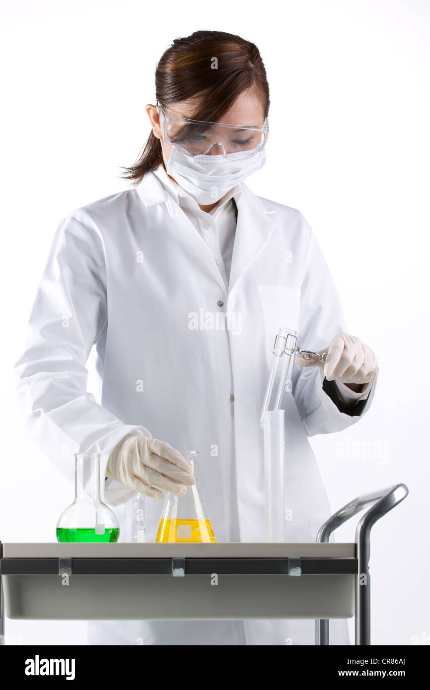 Portrait of a scientist analyzing a solution Stock Photo - Alamy