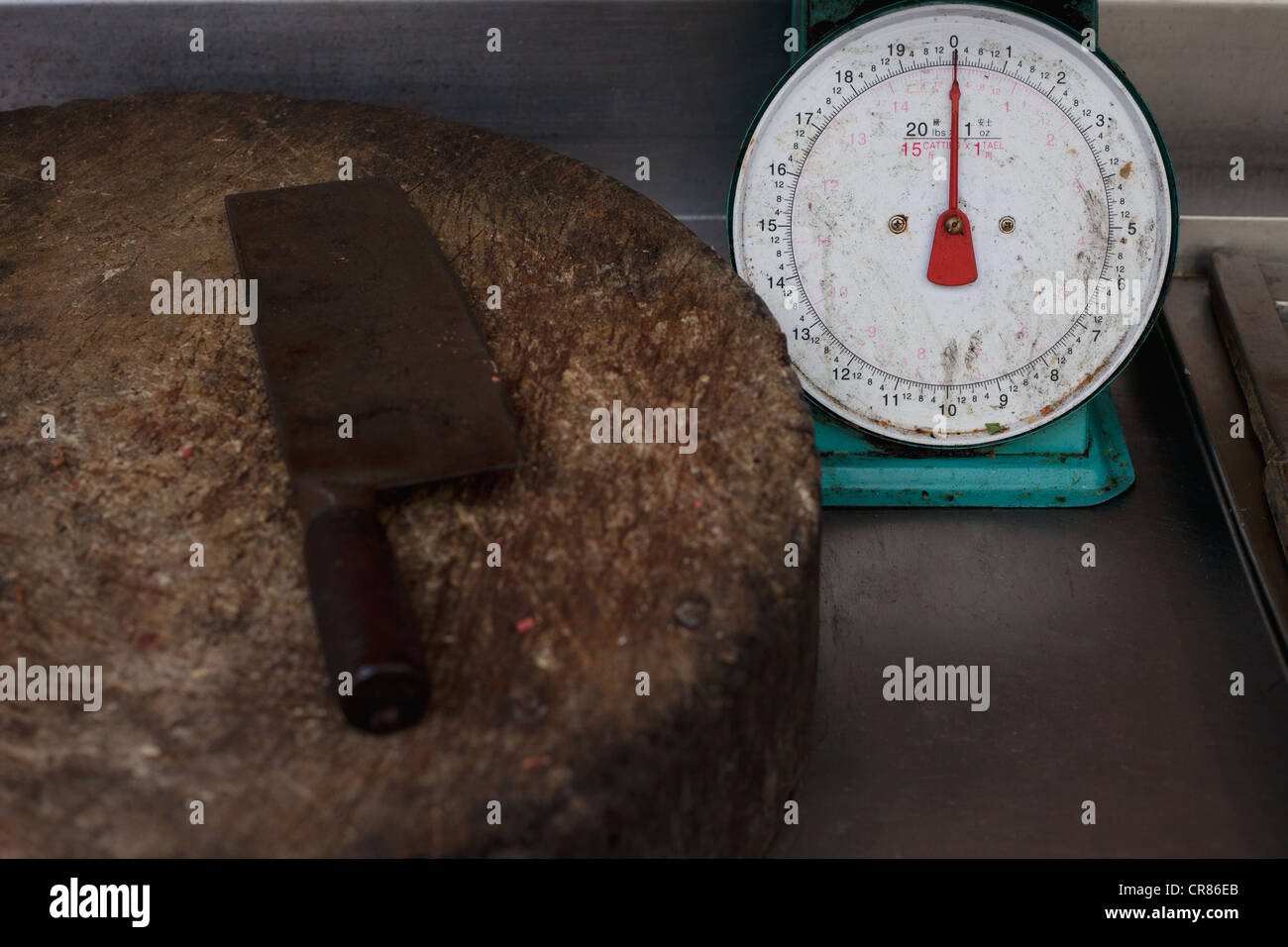 Knife on chopping board with weighing scale in market of Hong Kong ...