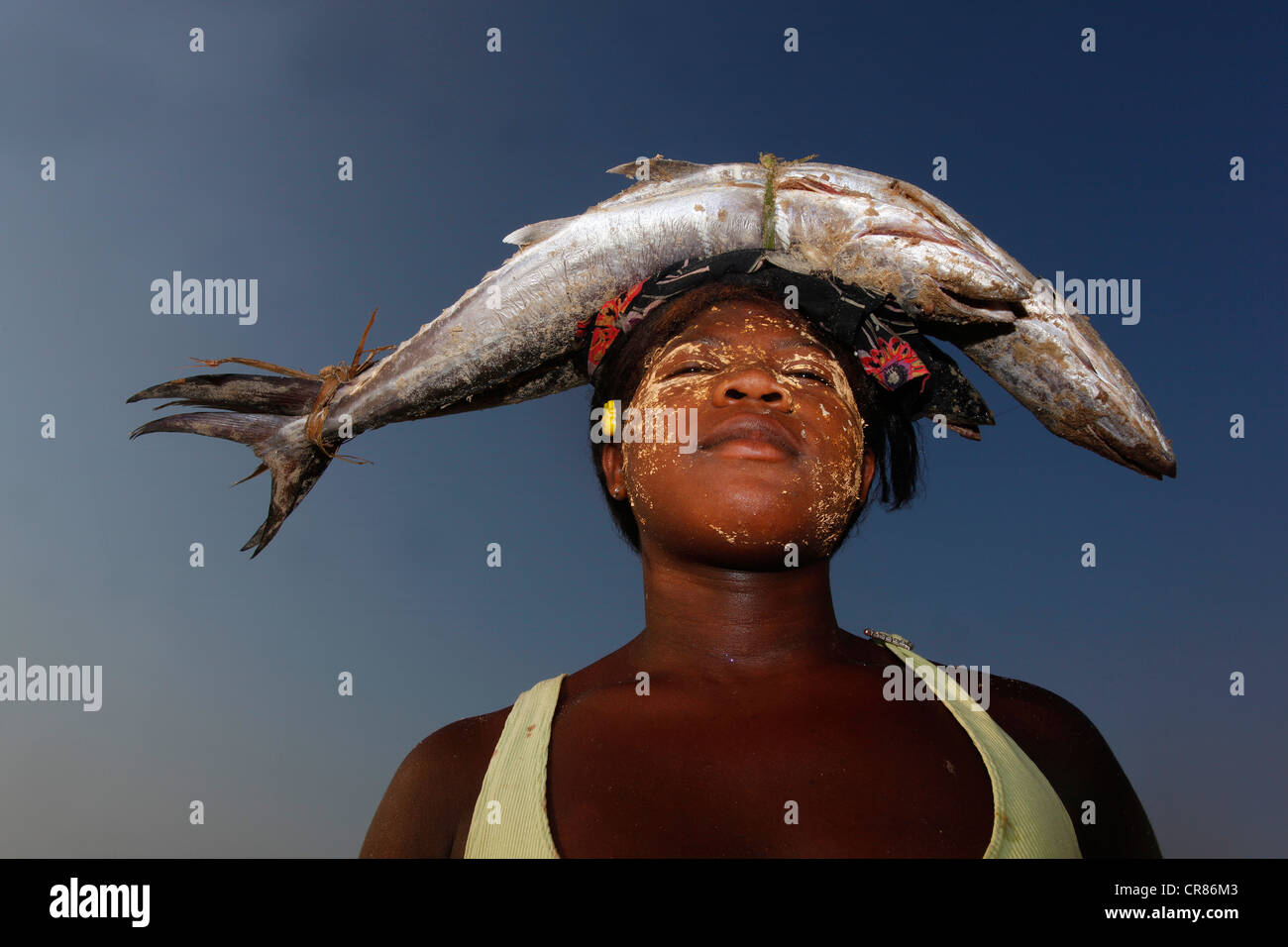 Fishwife carrying a fish on her head, Morondava, Madagascar, Africa ...