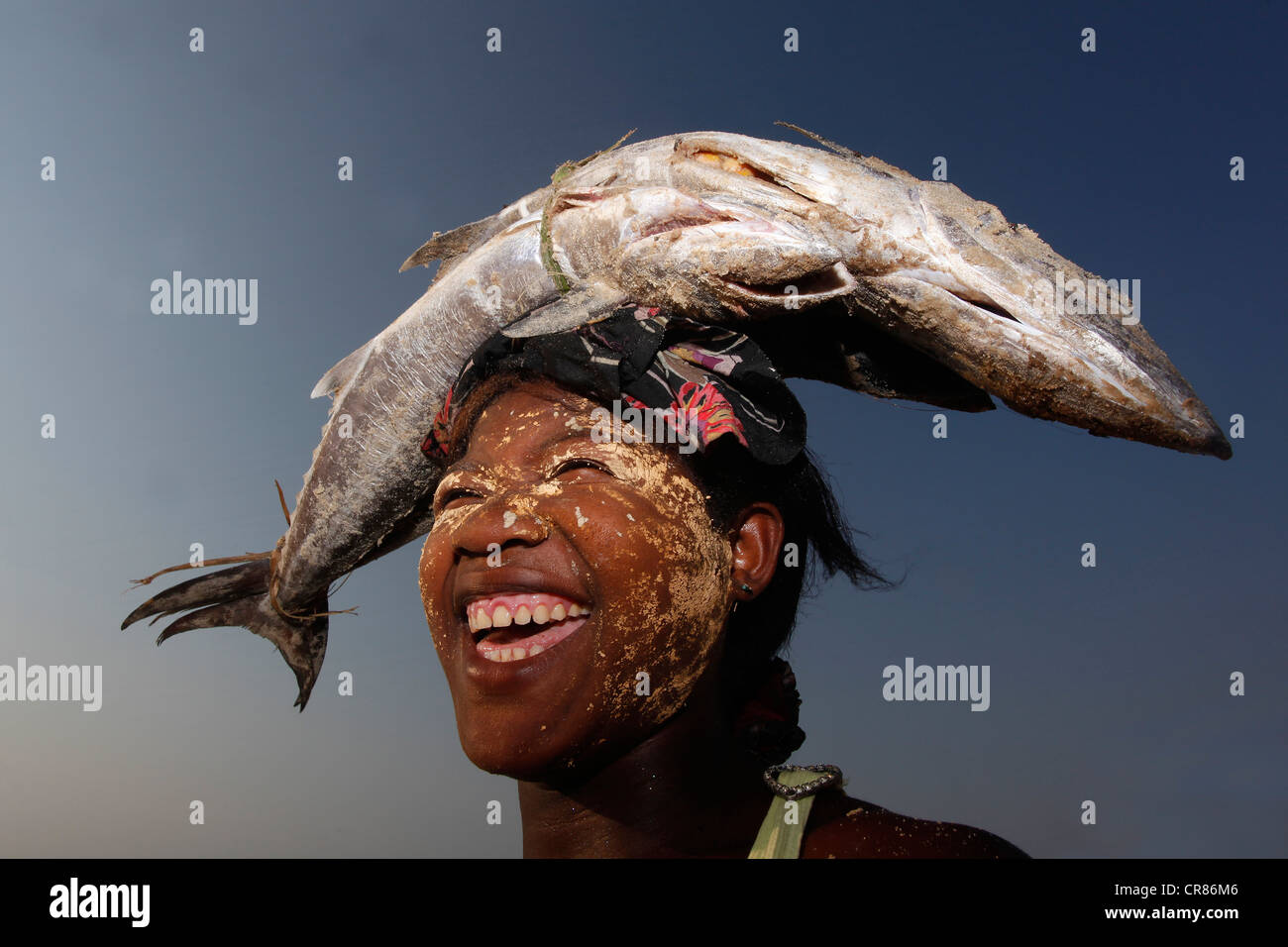 Fishwife carrying a fish on her head, Morondava, Madagascar, Africa ...