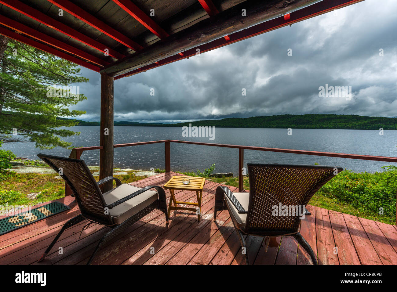 Deck of lakefront cabin at the Killarney Lodge resort just before a ...