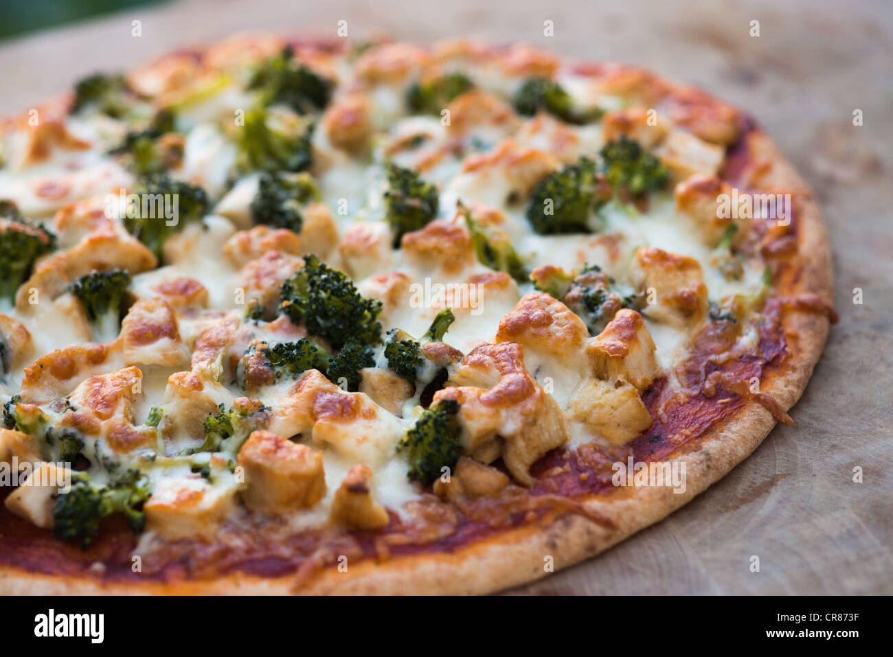 Pizza on a wooden board Stock Photo - Alamy