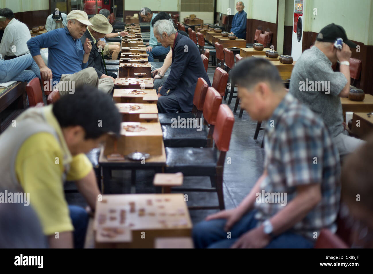 Playing shogi boardgame in a shogi parlor, in Shinsekai district, in ...