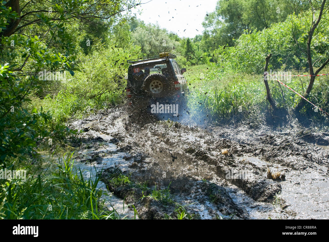 off-road driving on dirt. spray of dirt Stock Photo - Alamy