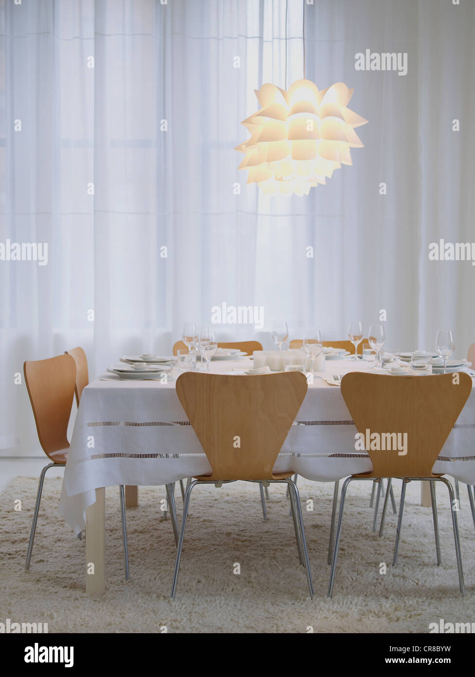 Modern table setting for a dinner party Stock Photo - Alamy