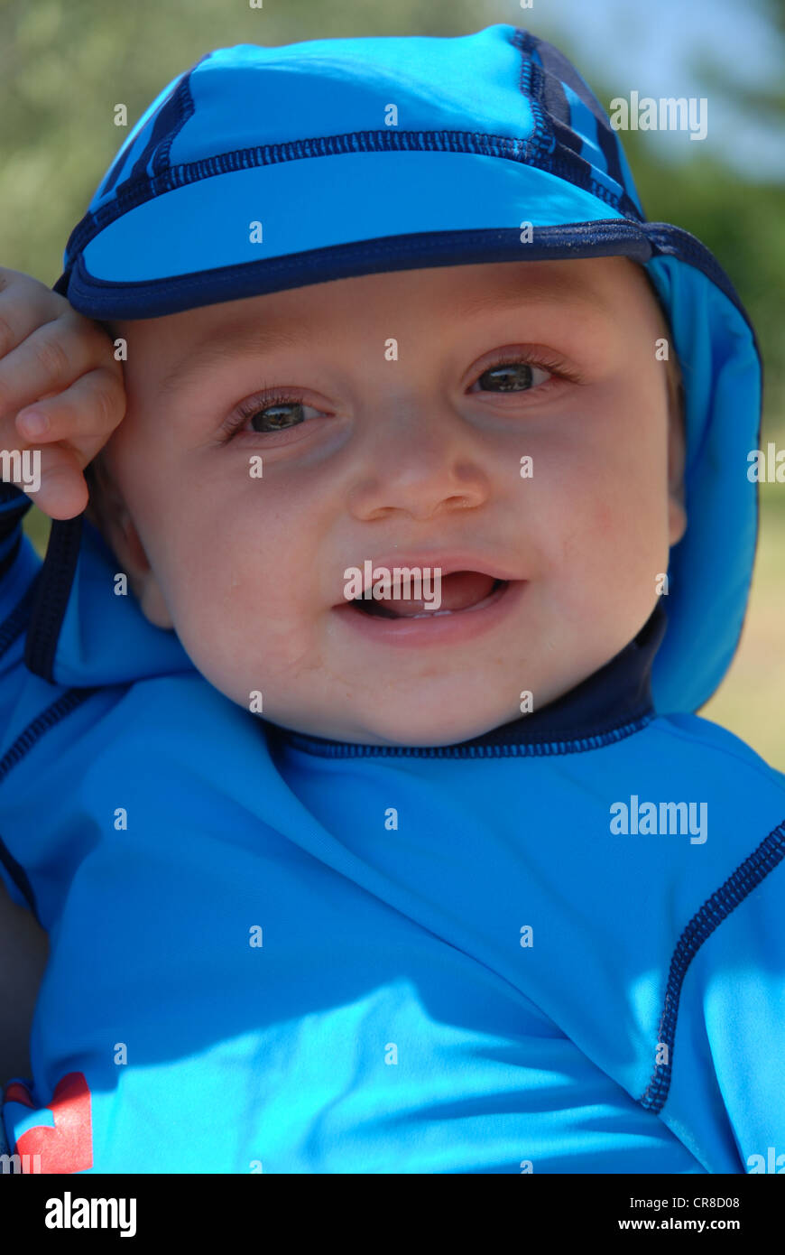 Baby boy in blue hat Stock Photo - Alamy