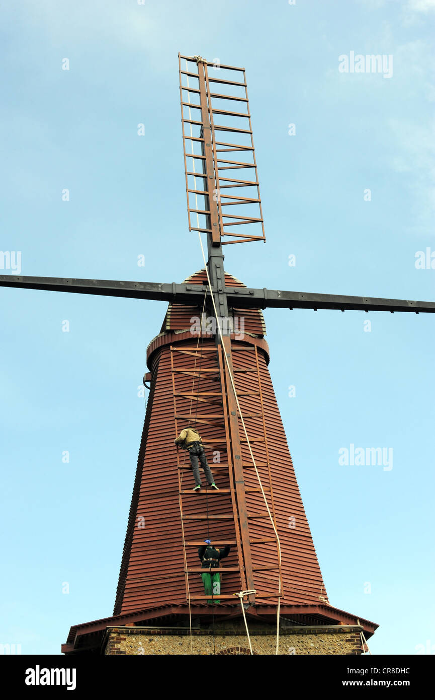 Men hard at work putting new sweeps onto Blatchington Mill Windmill in ...