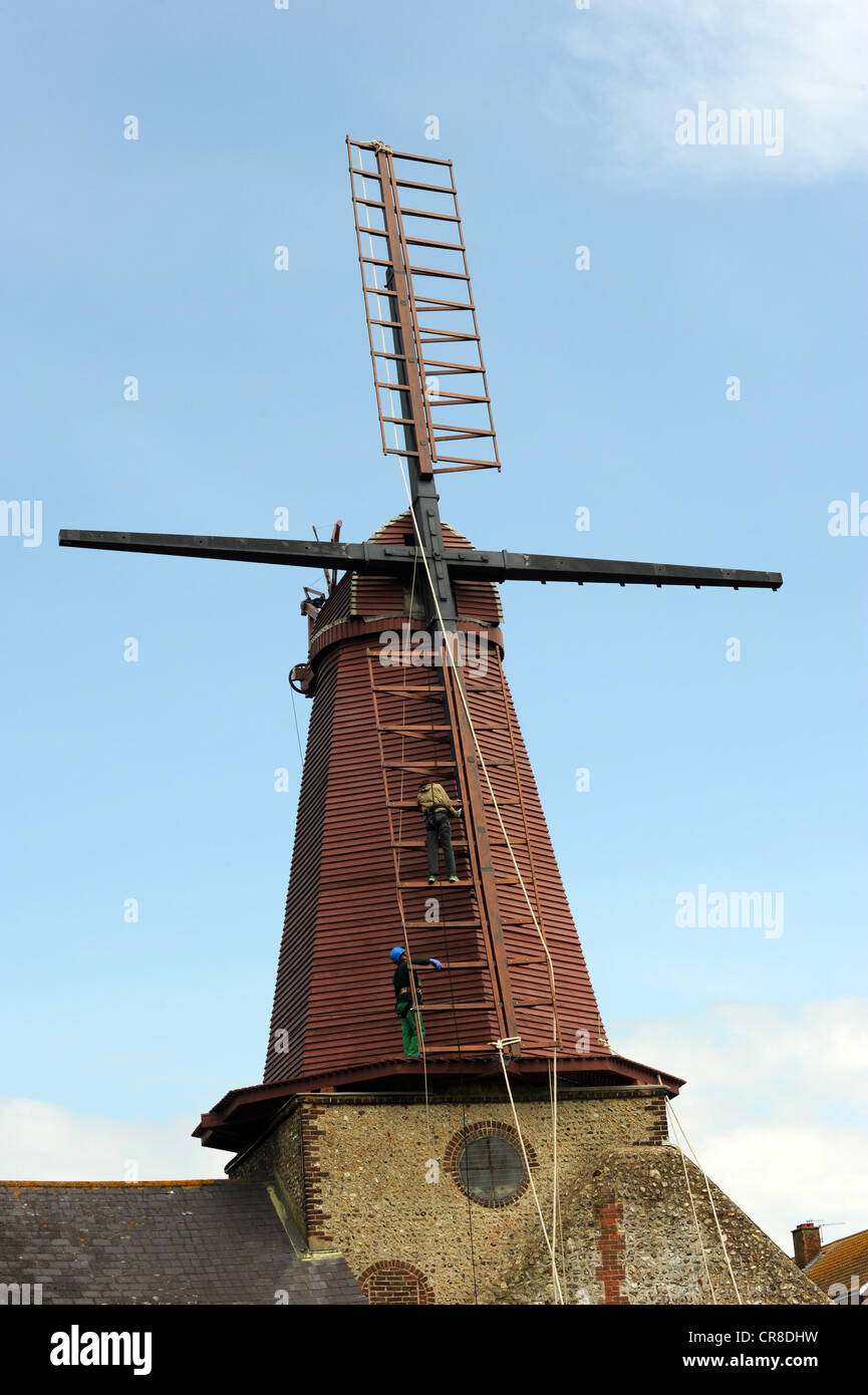 Men hard at work putting new sweeps onto Blatchington Mill Windmill in ...