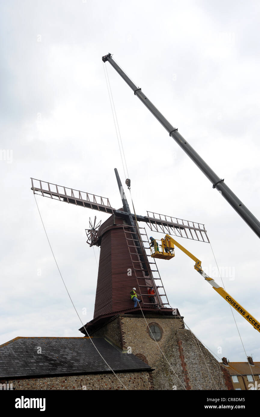 Men hard at work putting new sweeps onto Blatchington Mill Windmill in ...