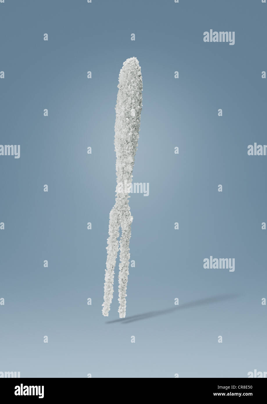 Creative cooking, Fork covered in salt grains Stock Photo - Alamy