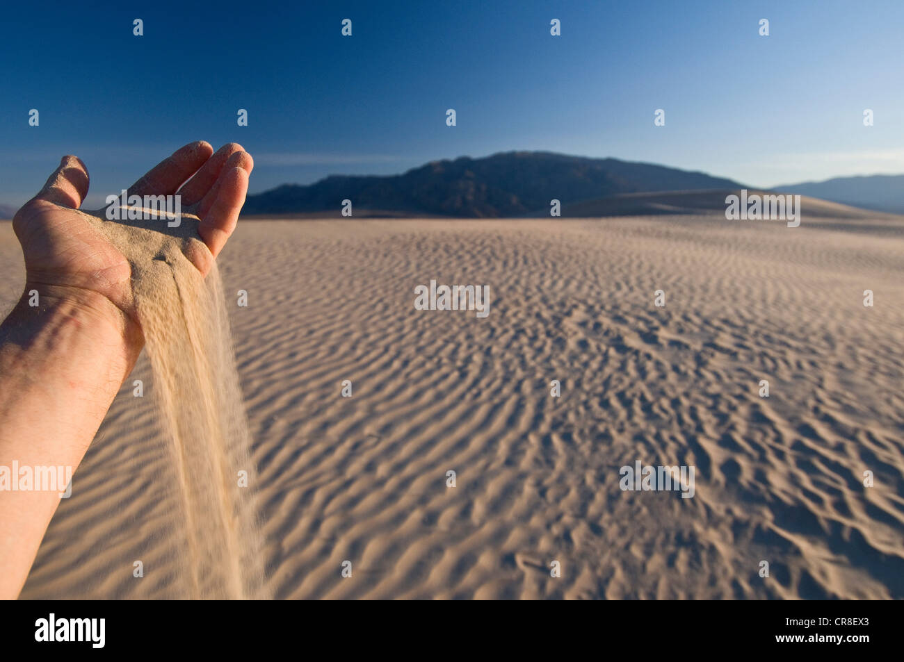 Hand holding sand in Death Valley National Park, California, USA Stock ...