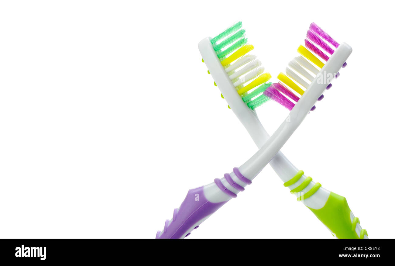 Two color toothbrushes . Photo closeup. Isolated on white background ...
