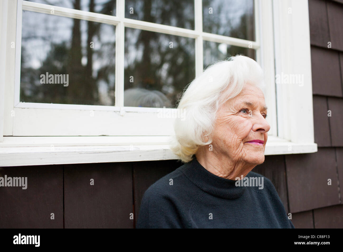 Old women outside house hi-res stock photography and images - Alamy