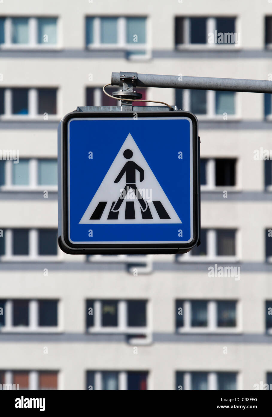 Pedestrian crossing sign in front of apartment buildings Stock Photo ...