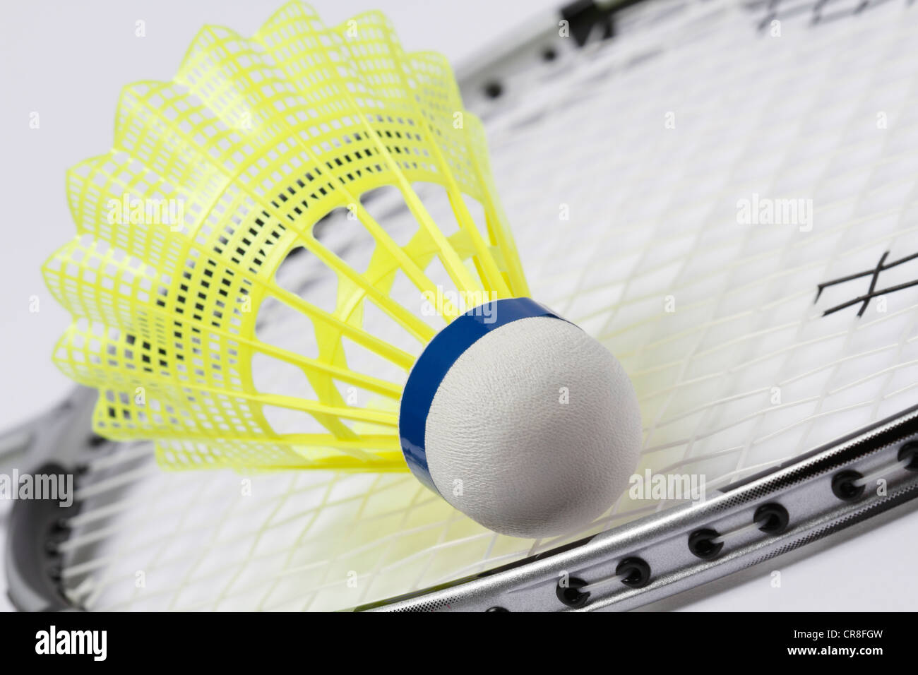 A shuttlecock and a badminton racket Stock Photo - Alamy
