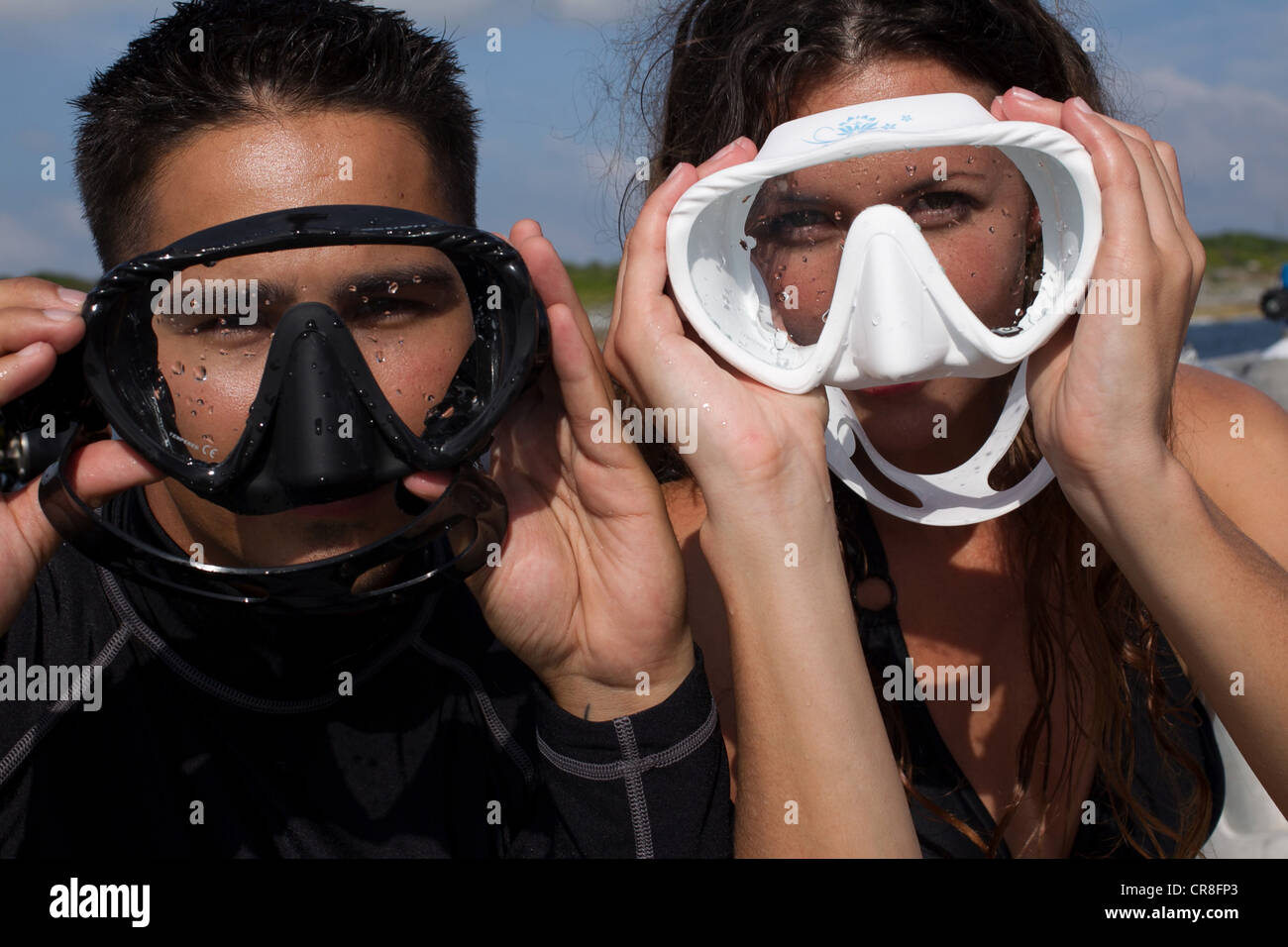 Playful Couple with Face Masks Stock Photo - Alamy