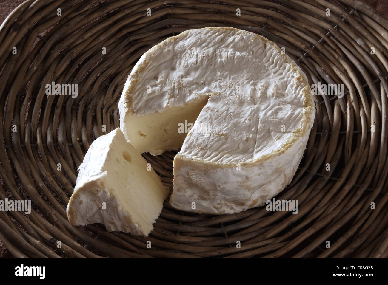 French soft cheese on a basket tray Stock Photo - Alamy