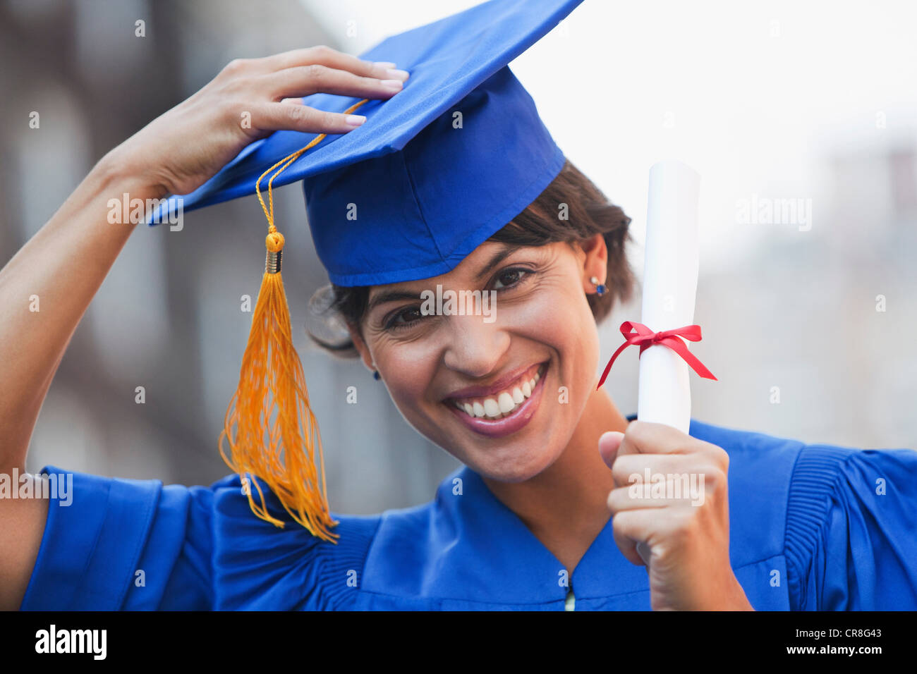 Portrait of mid adult woman graduating, smiling Stock Photo - Alamy