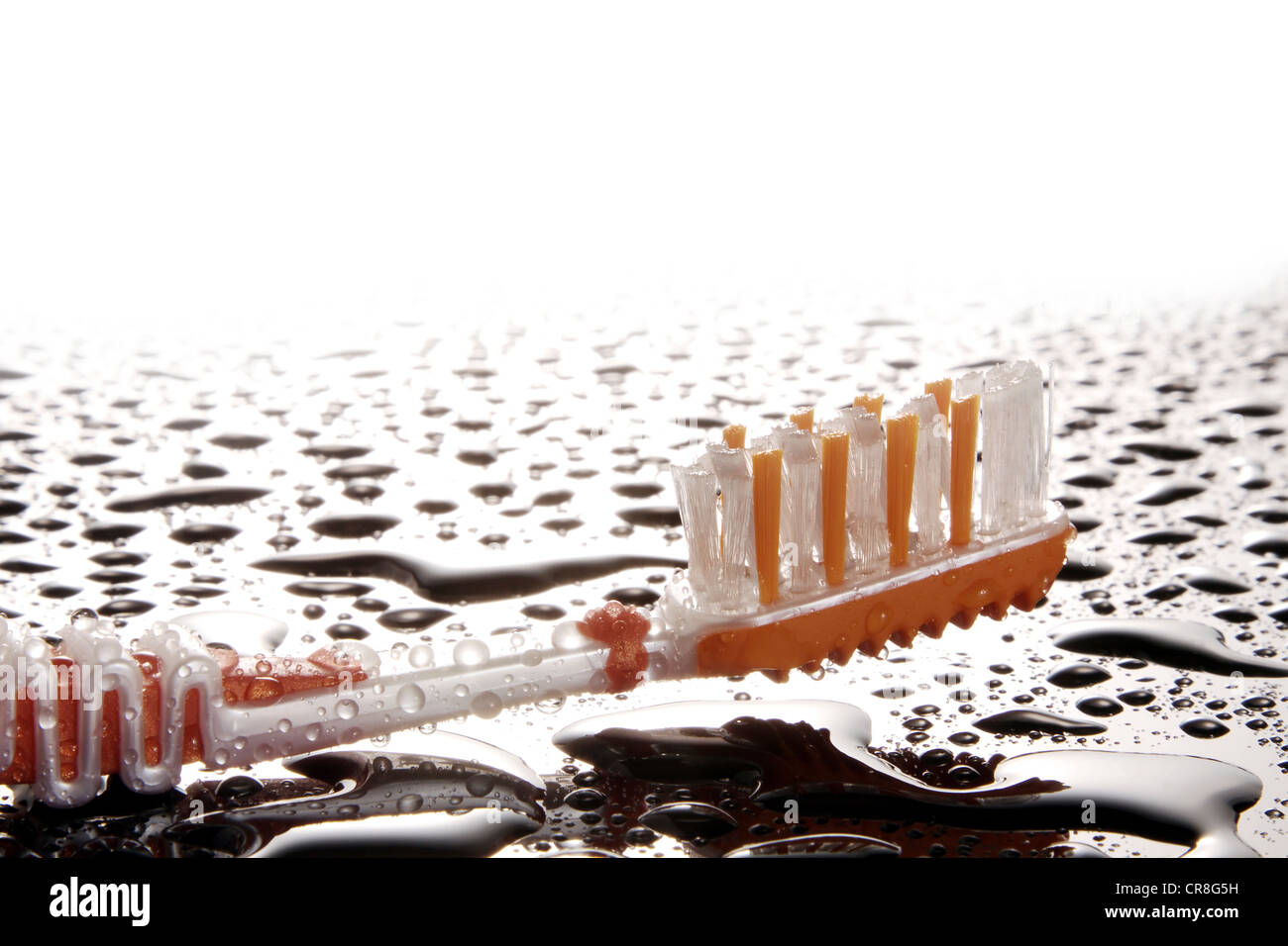 Toothbrush with water drops Stock Photo - Alamy
