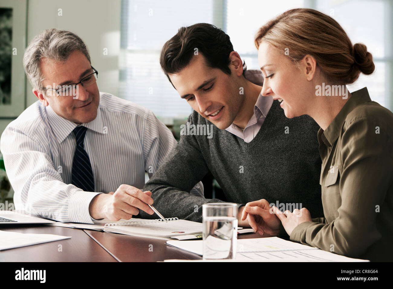 Financial advisor meeting with young couple Stock Photo - Alamy