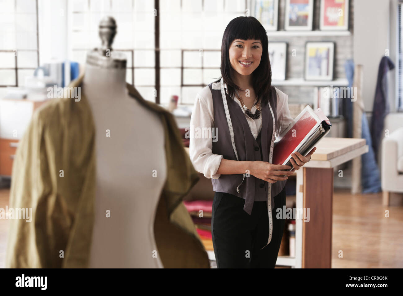 Portrait of fashion designer in studio Stock Photo - Alamy