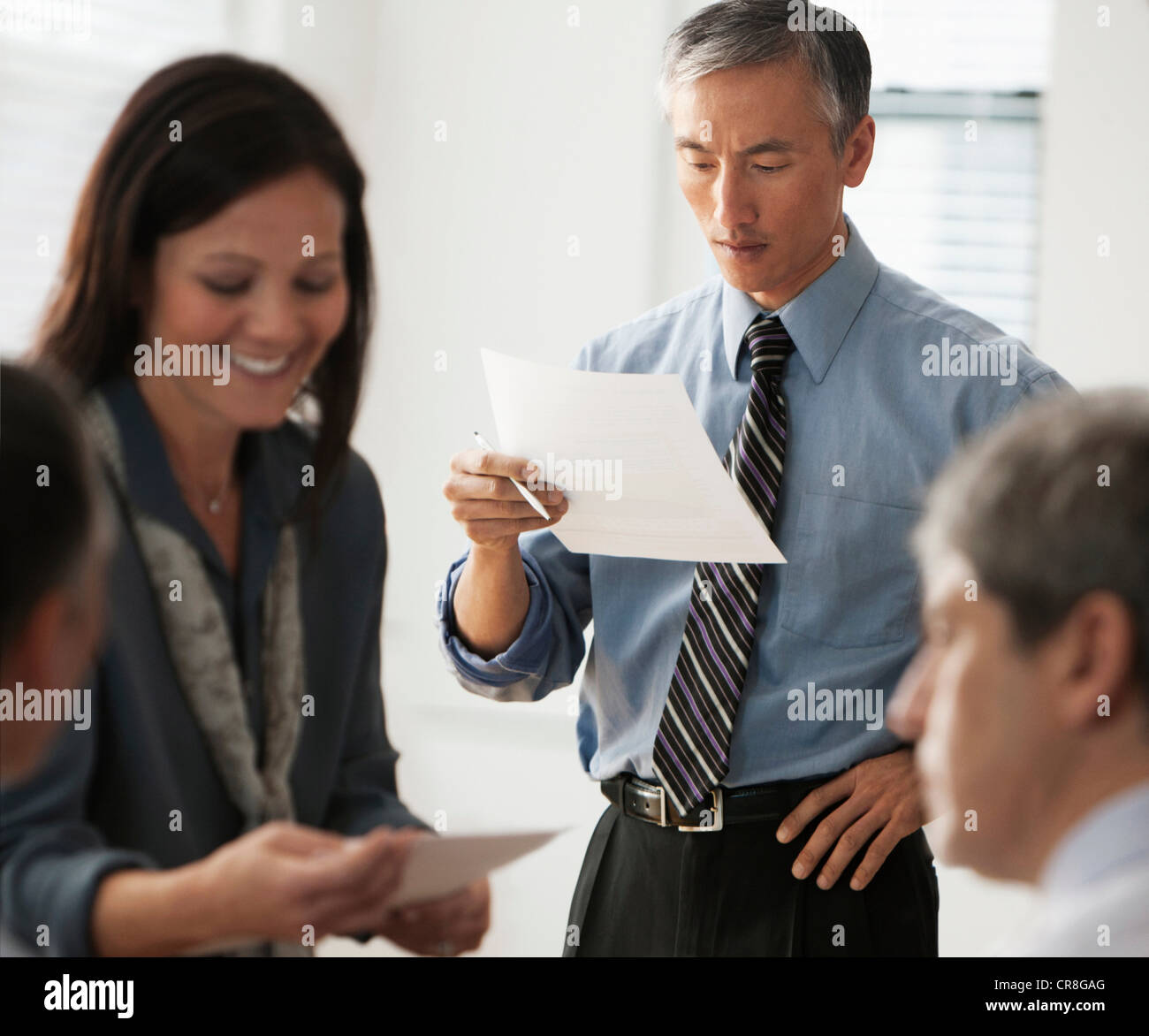 Colleagues reading document hi-res stock photography and images - Alamy