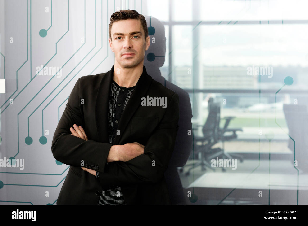 Portrait of young man in IT office Stock Photo - Alamy