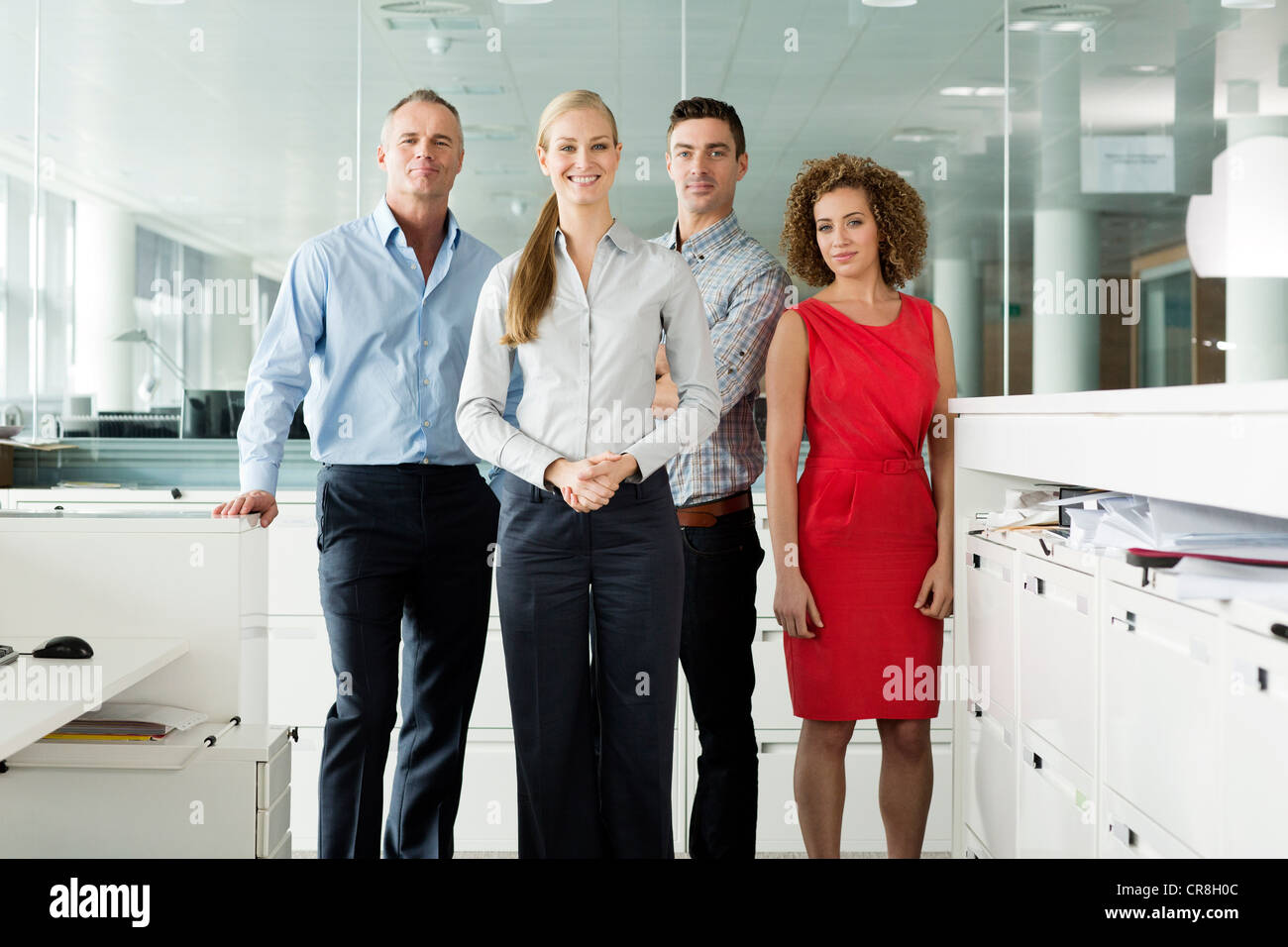 Portrait of colleagues in office, smiling Stock Photo - Alamy