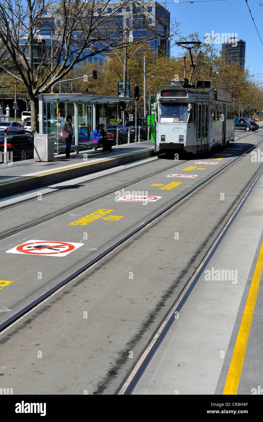 Melbourne Tram approaching tram-stop Stock Photo - Alamy