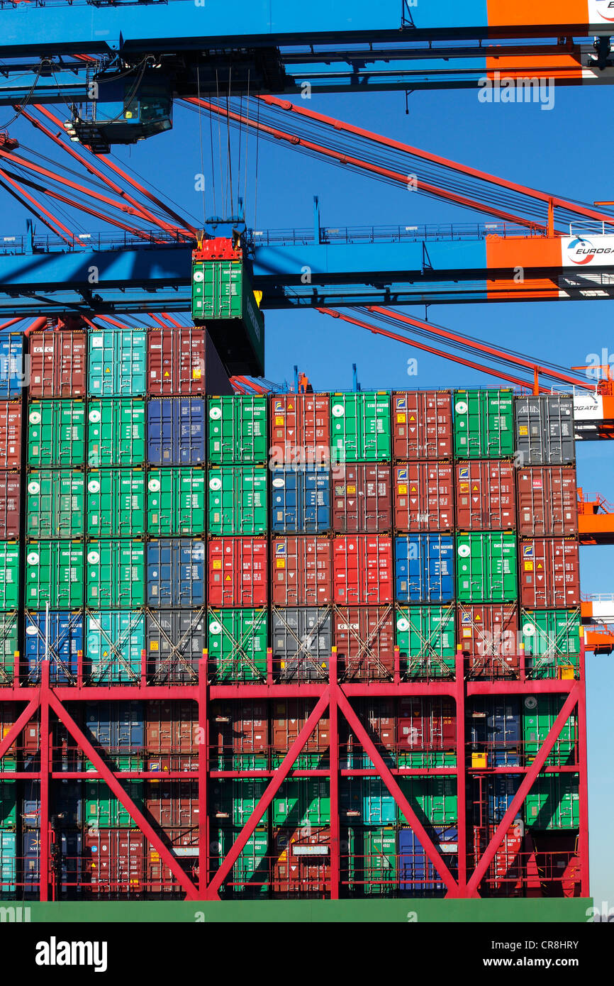 Containers being loaded on a ship at the Container Terminal Eurokai in ...