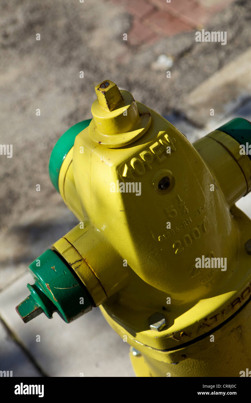 yellow and green fire hydrant Stock Photo - Alamy