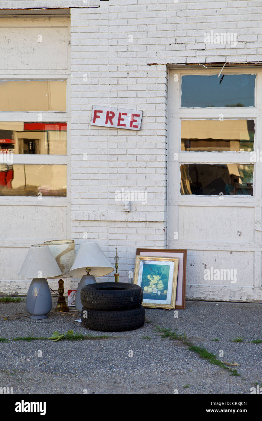 various items along a building underneath a sign saying free Stock ...