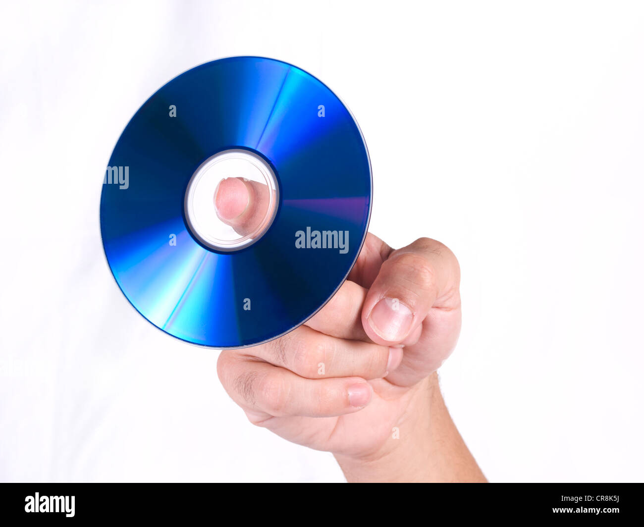 One person holds the disk with his finger and point you Stock Photo - Alamy