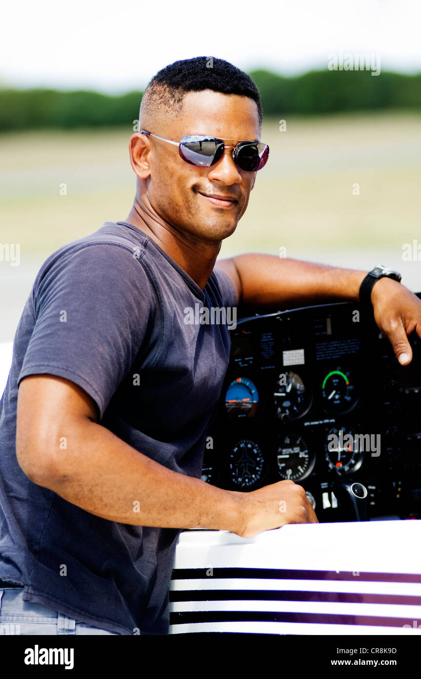 African american pilot checking hi-res stock photography and images - Alamy