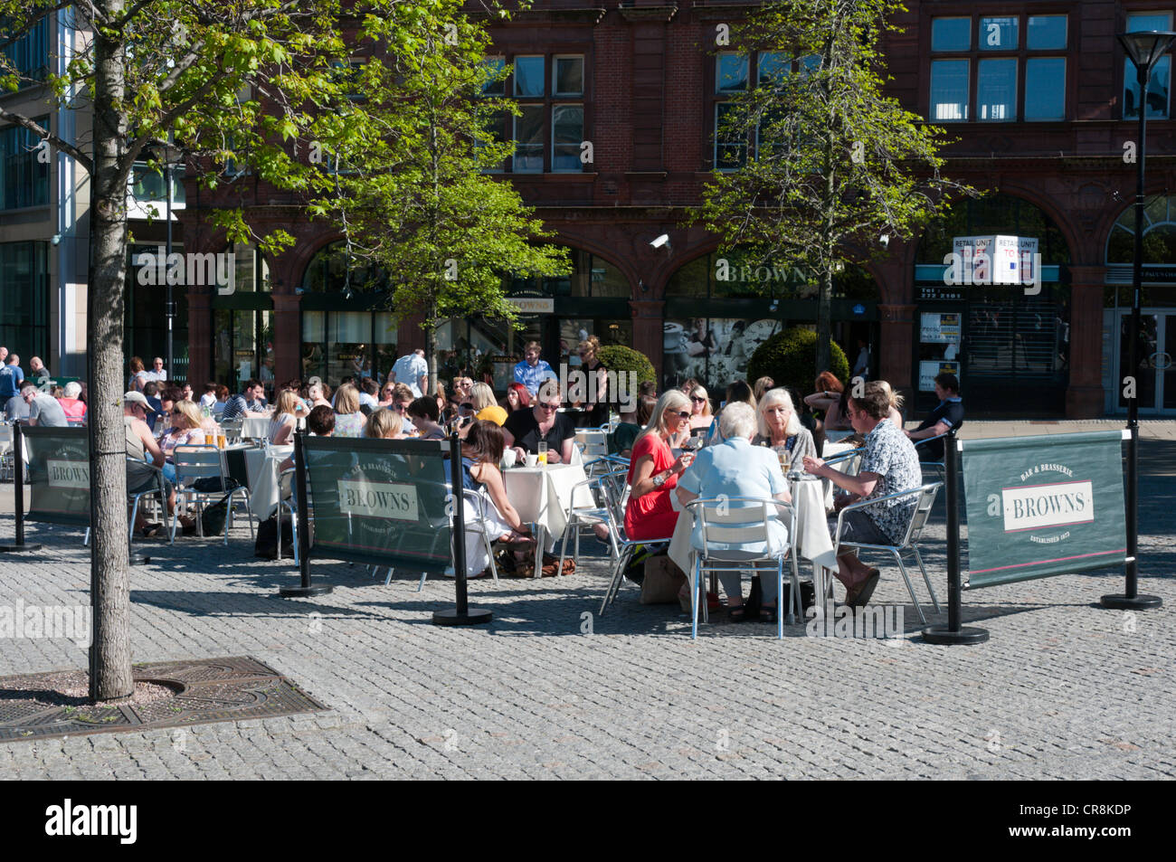 People sitting at cafe tables outside Browns Bar and Brasserie in ...