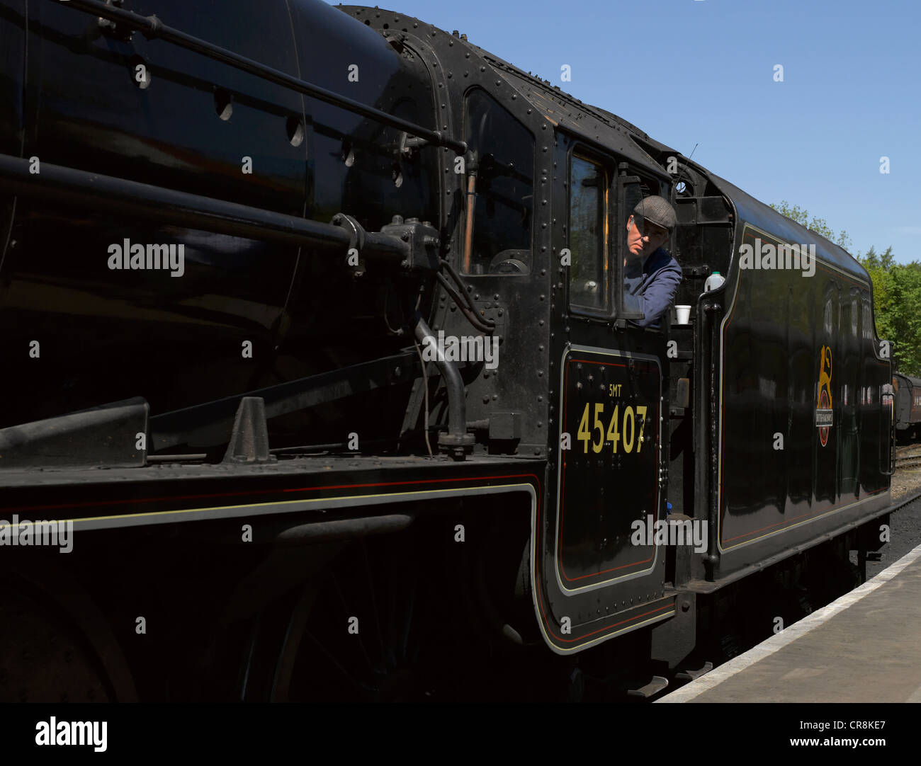 Engine driver on steam locomotive train Lancashire Fusilier Pickering ...