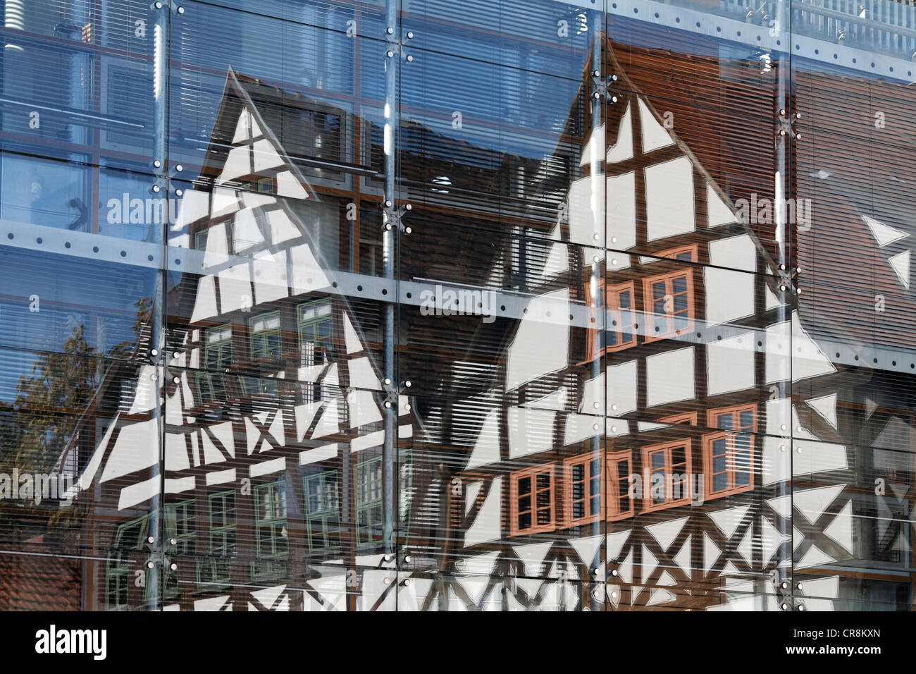 Half-timbered houses reflected in modern glass facade, Benediktplatz ...
