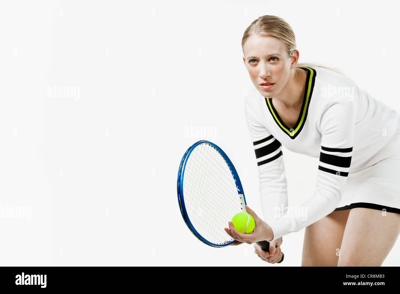 Tennis player serving ball Stock Photo - Alamy