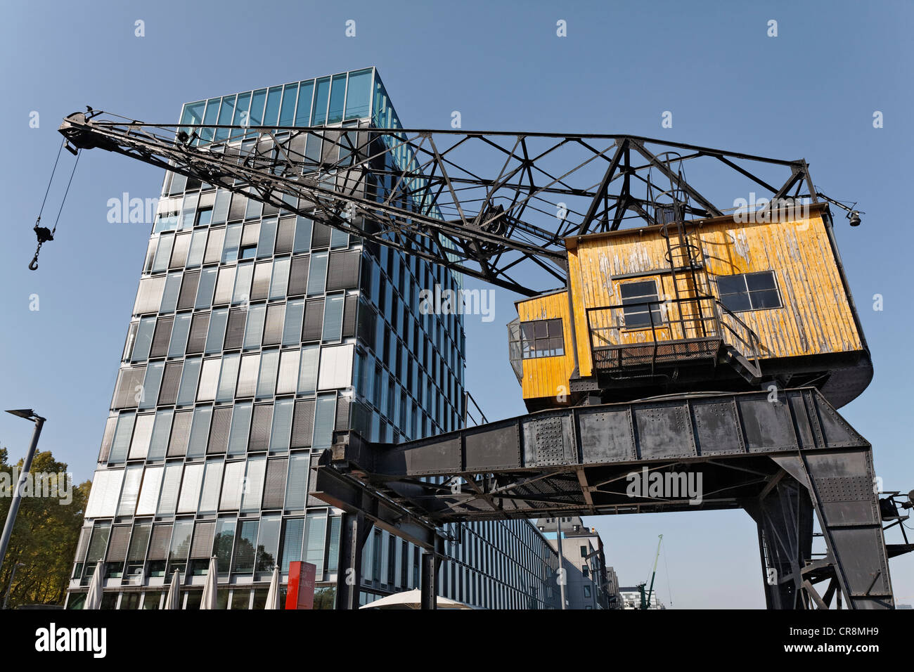 Old port crane in front of the KAP building at the south quay ...