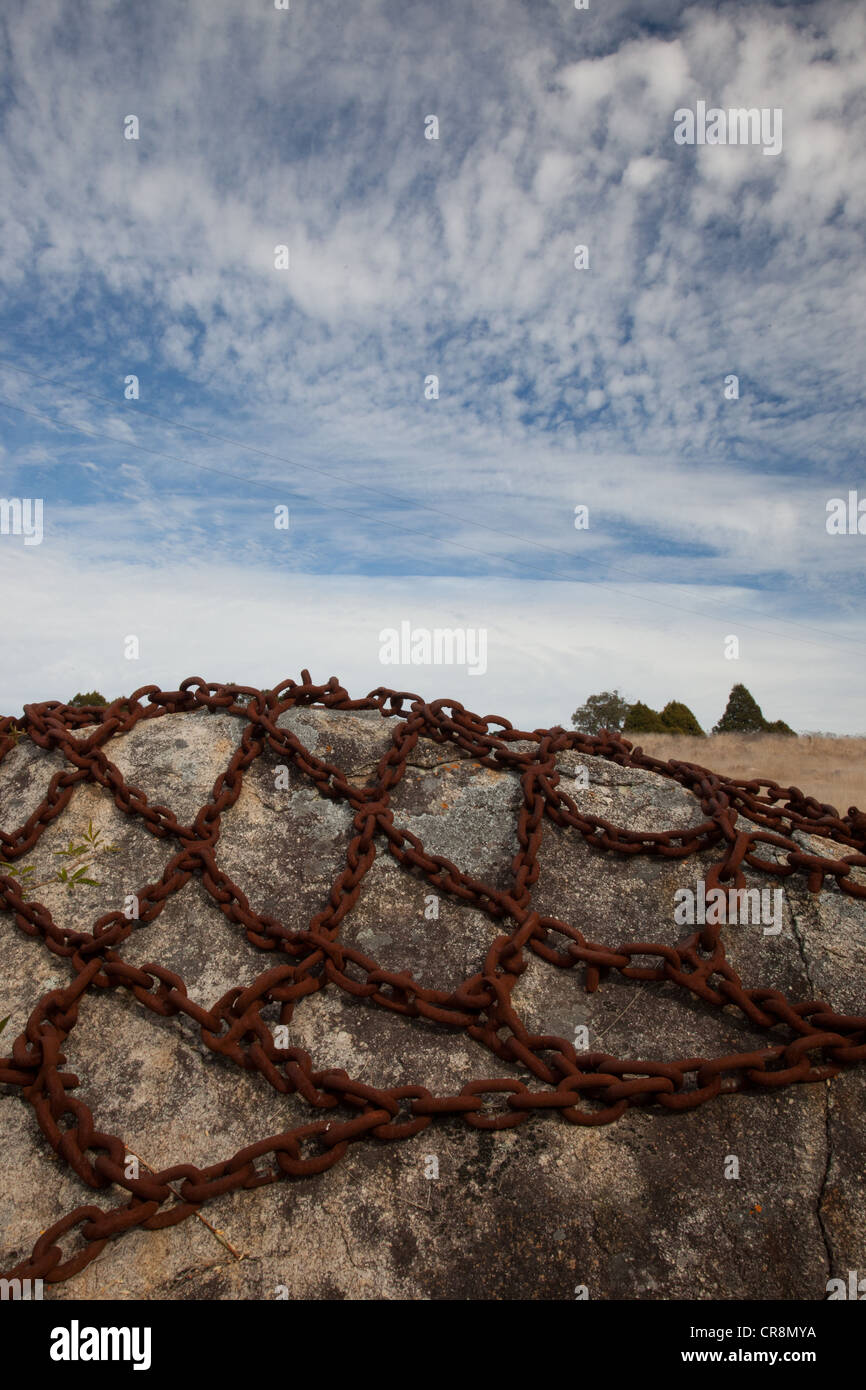 Rusty Chains on a boulder in Australia Tenterfield Stock Photo - Alamy