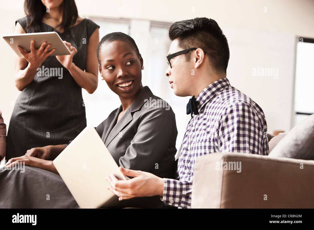 Three business people in meeting Stock Photo - Alamy