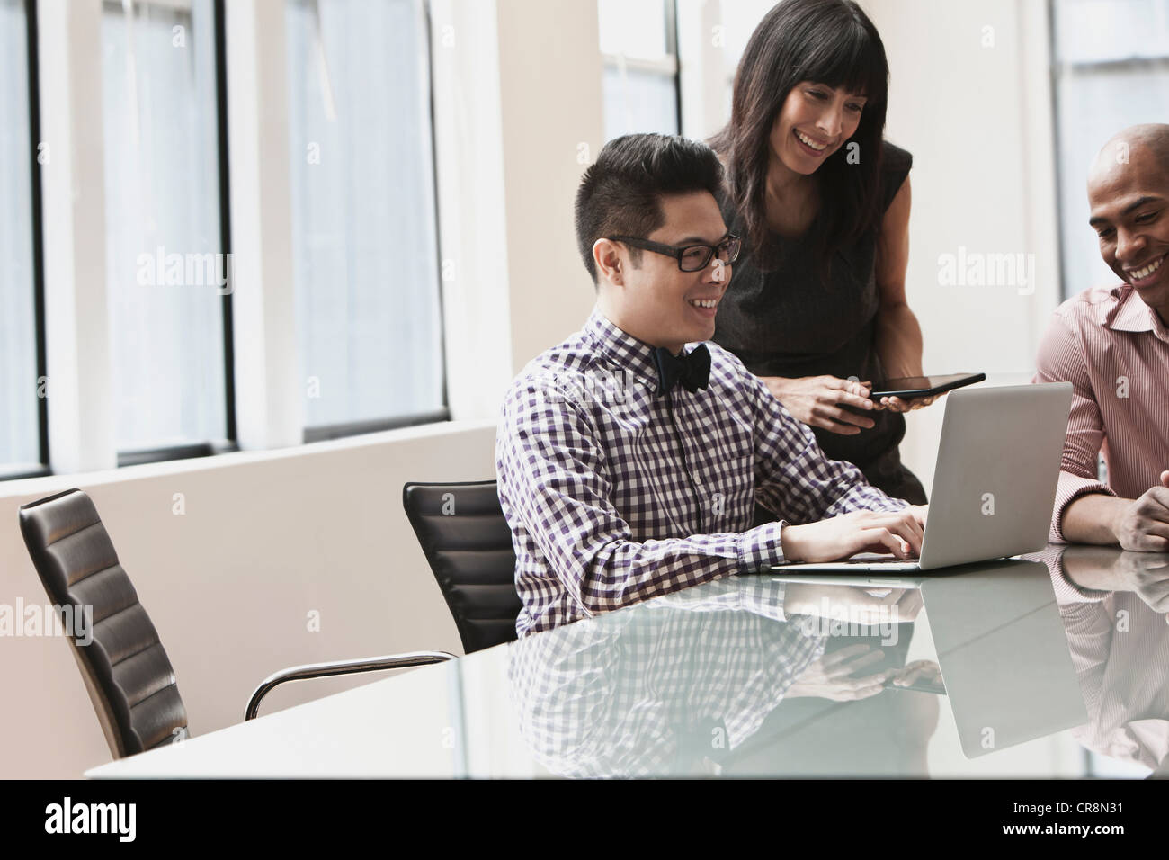 Three business people in meeting Stock Photo - Alamy
