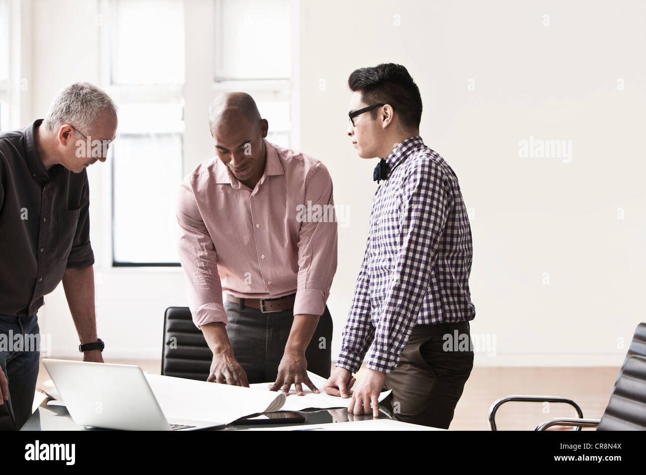 Three business people in meeting Stock Photo - Alamy