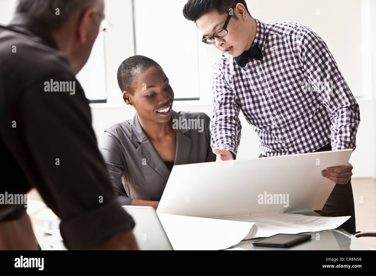 Three business people in meeting Stock Photo - Alamy