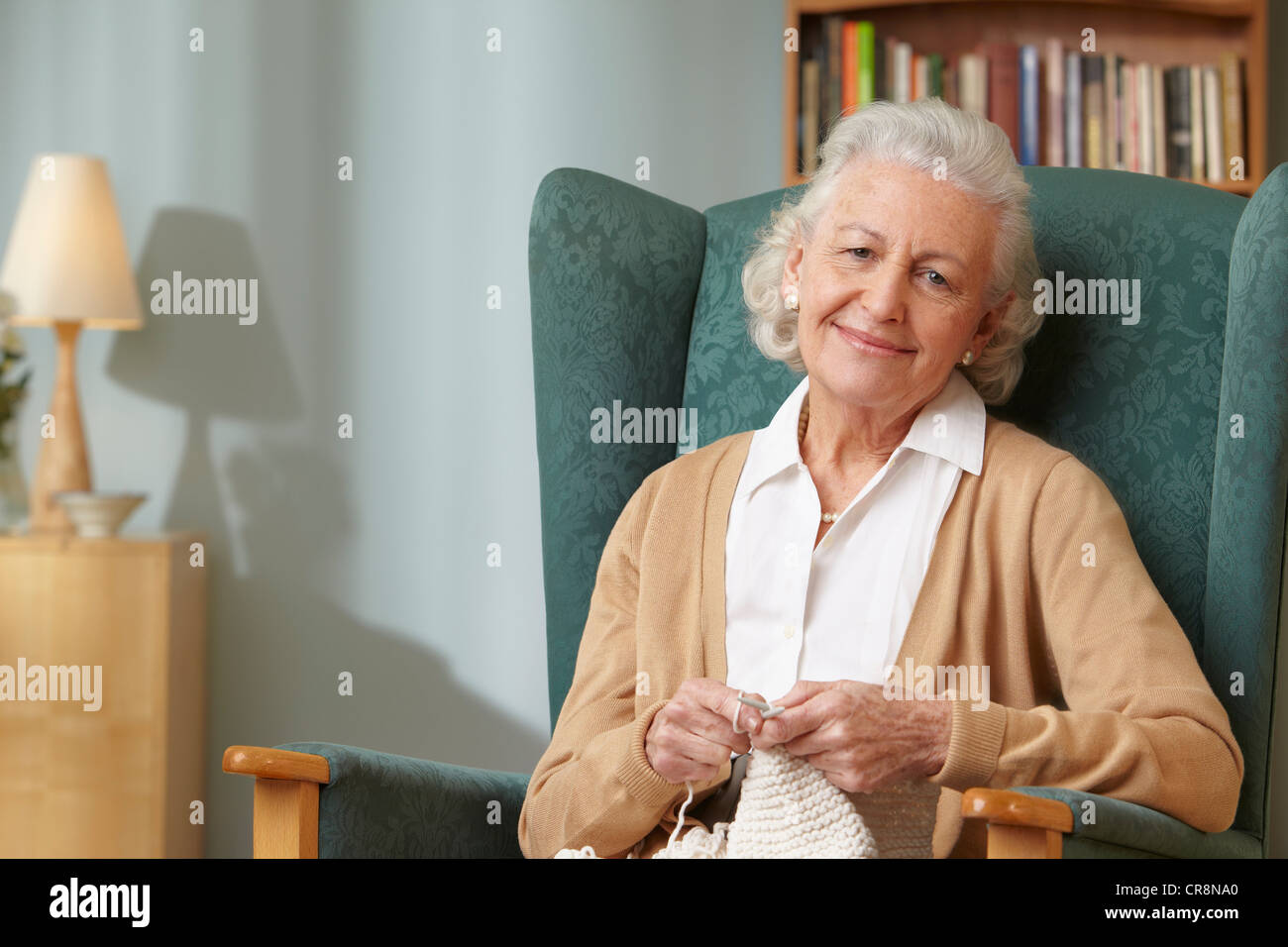Senior woman knitting, portrait Stock Photo - Alamy