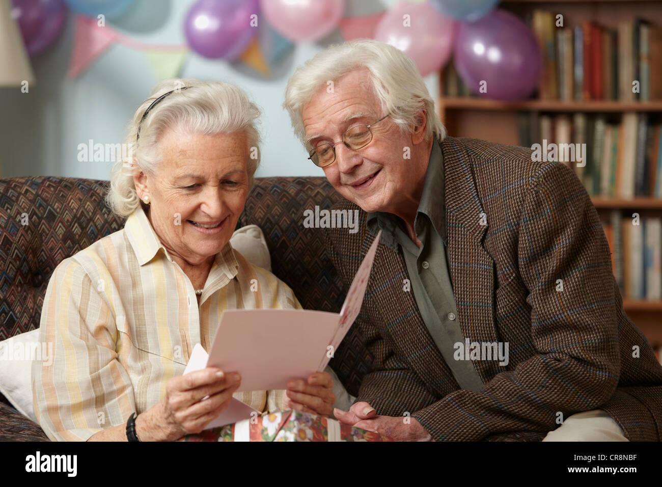 Senior couple reading birthday card hi-res stock photography and images ...